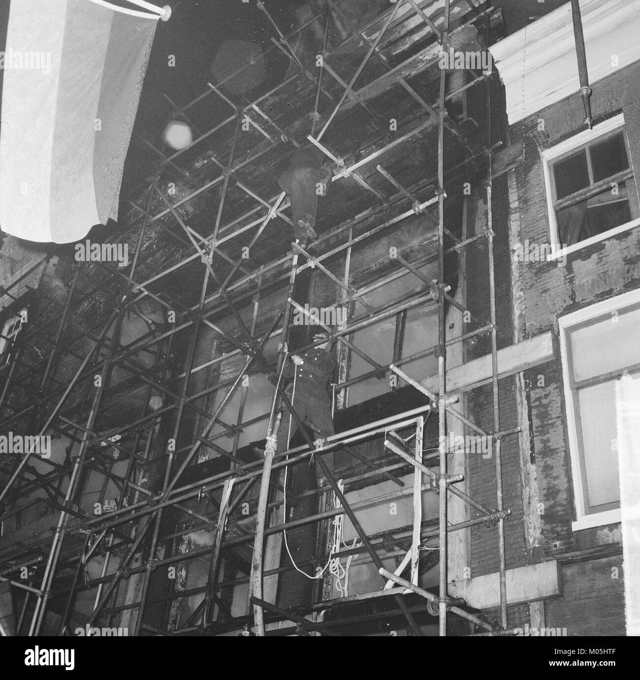 This image depicts the aftermath of a fire at building number 132 on ...