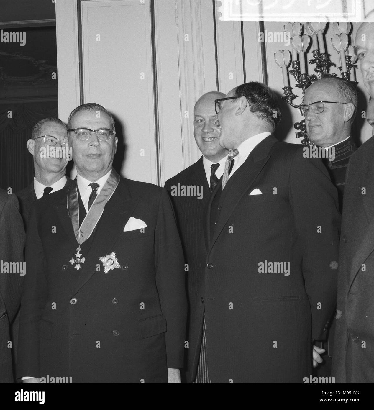 The photograph depicts a ceremony where the British Ambassador honors ...