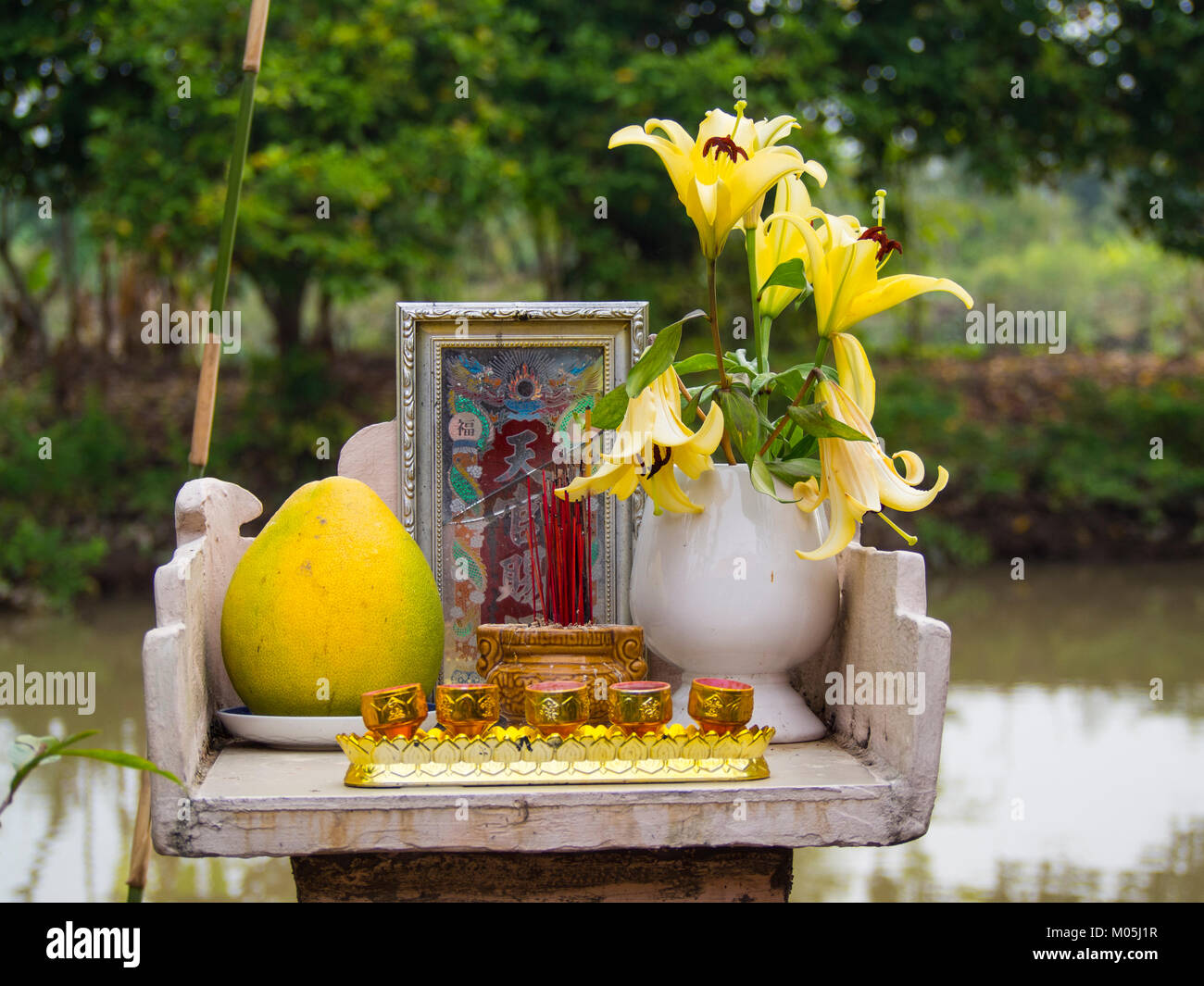 Buddhist altar in front of vietnamese house Stock Photo - Alamy