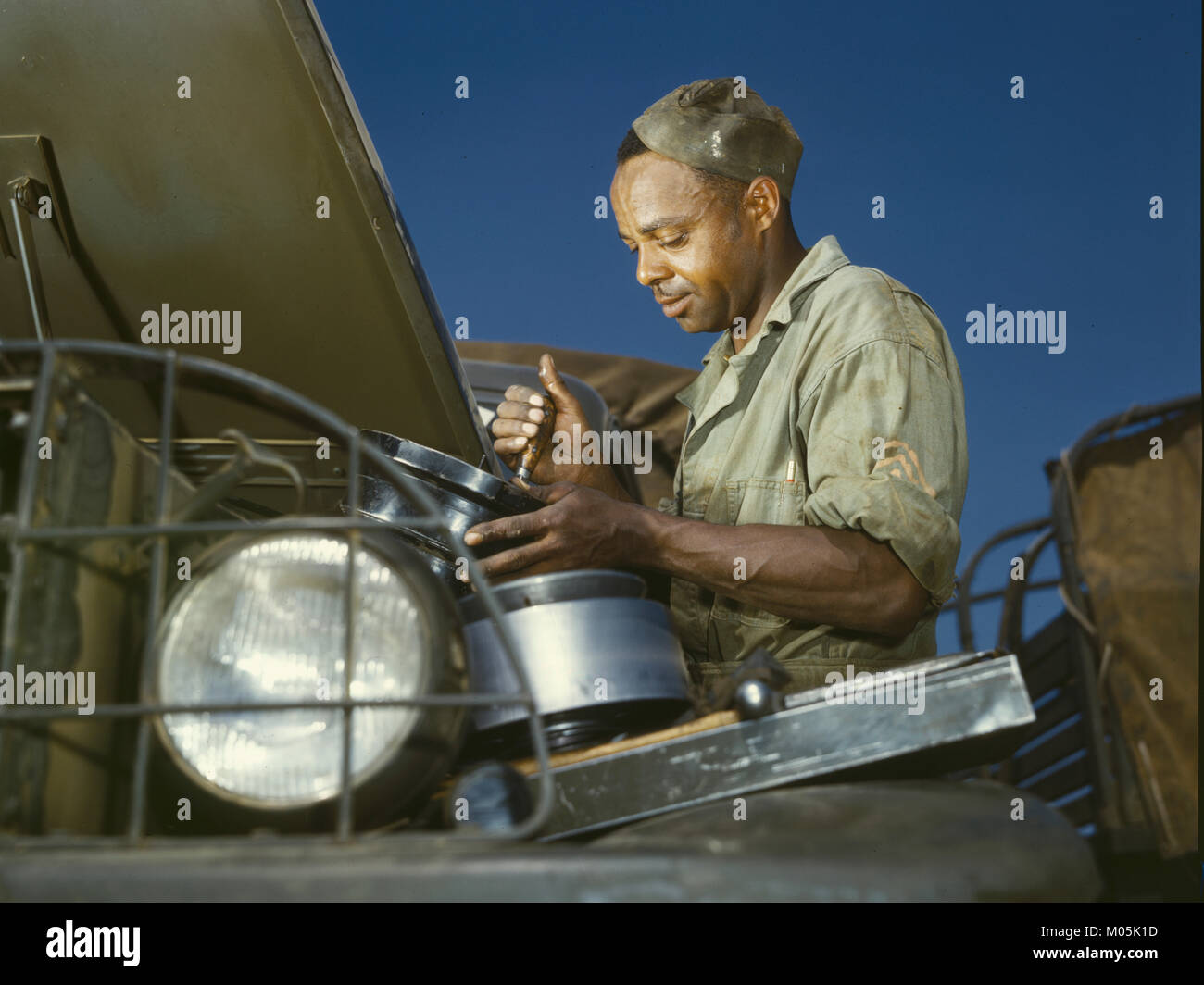 African American mechanic, motor maintenance section Stock Photo - Alamy