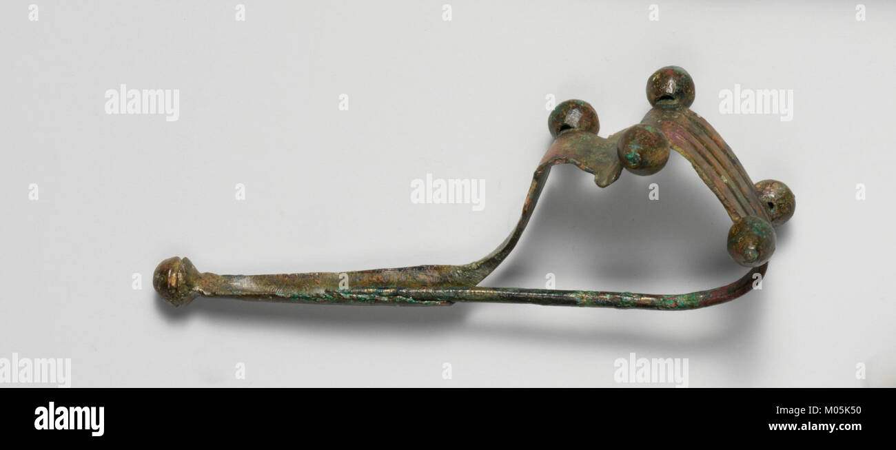 This bronze dragon-type fibula, dating back to ancient times, was used ...