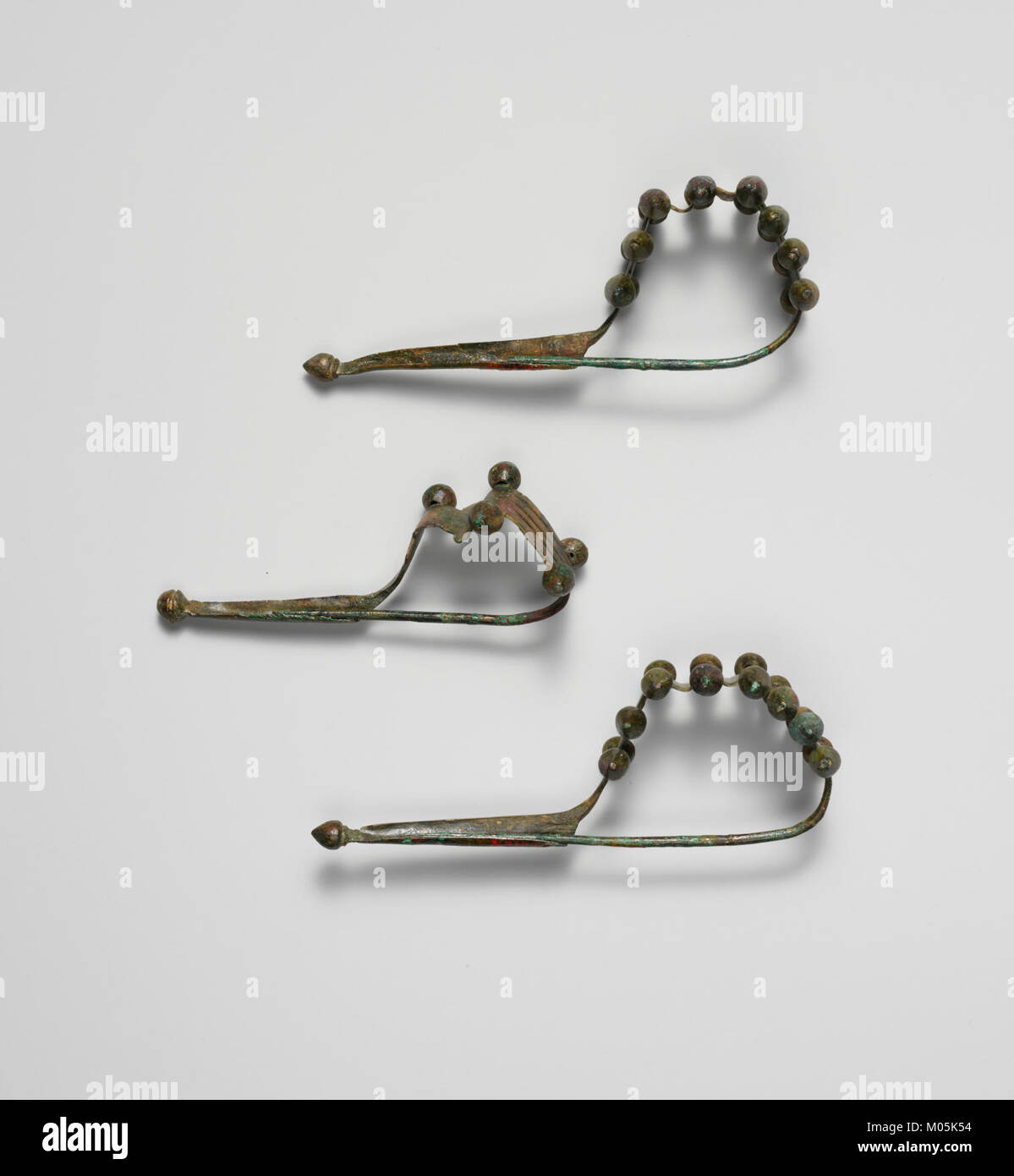 A bronze dragon-type fibula (safety pin), cataloged by the Metropolitan ...