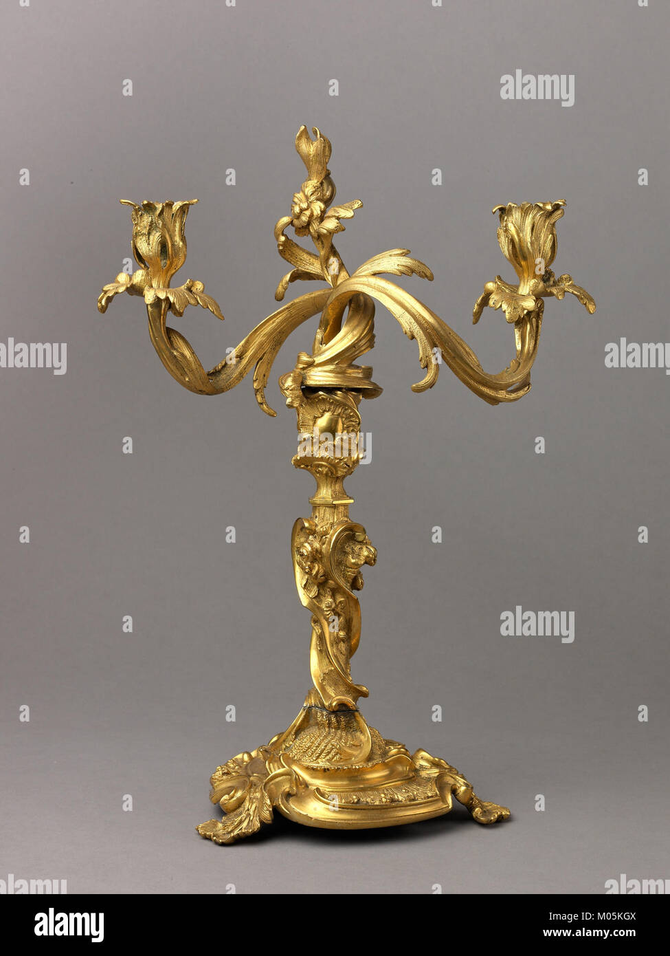 Image of a candlestick with two branches, displayed at the MET ...