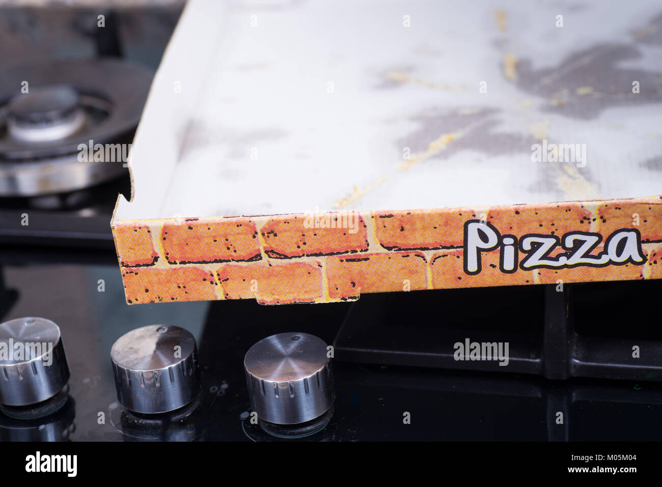Used cardboard pizza box with grease stains lesft on its bottom Stock ...