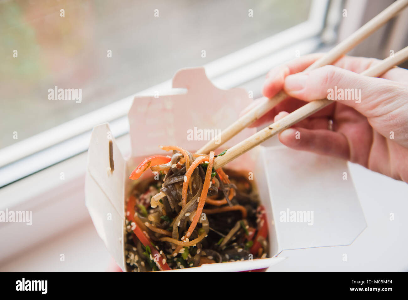 Noodles with vegetables in take-out box Stock Photo - Alamy