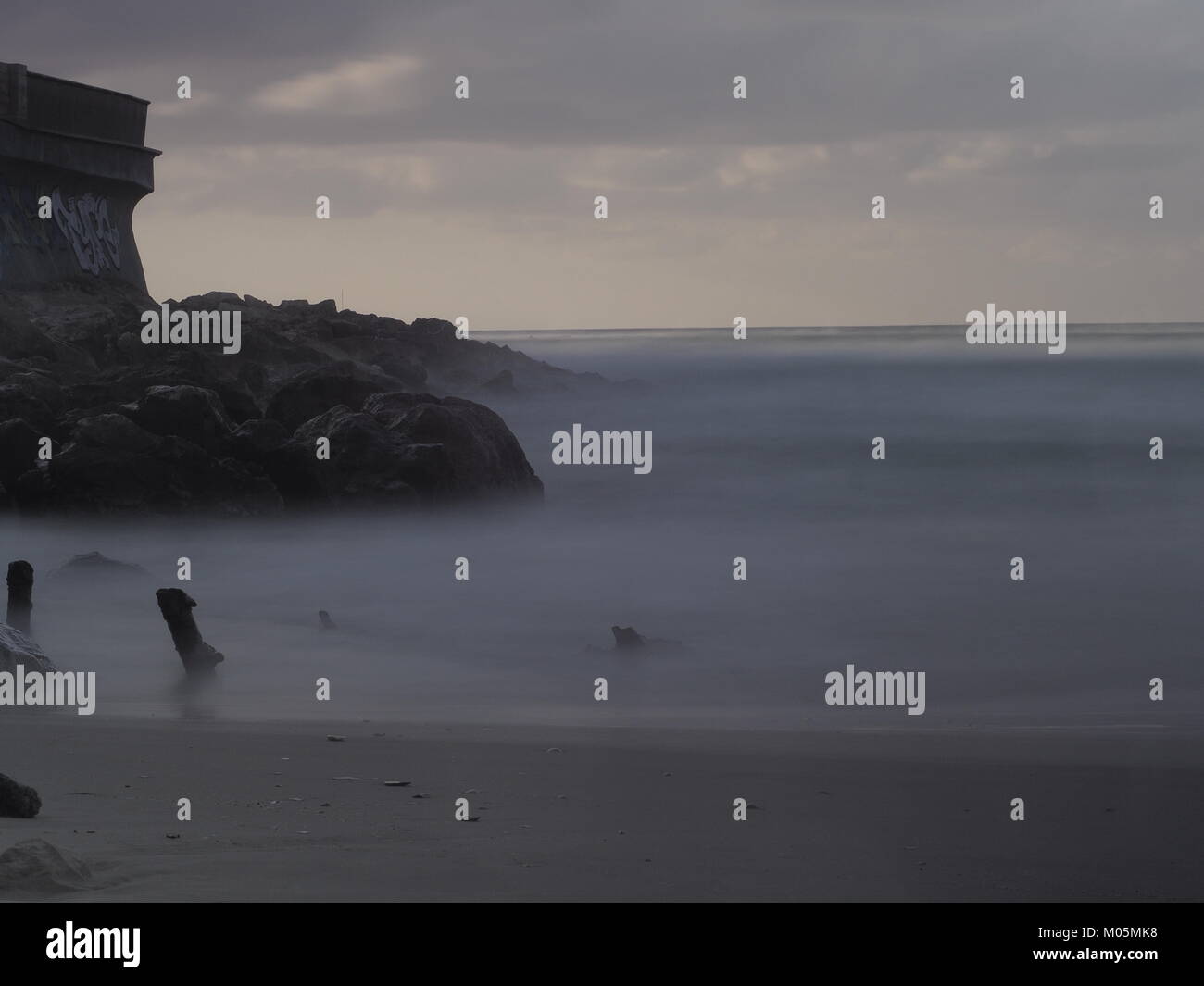 moving and breaking waves on the coast rocks Stock Photo - Alamy