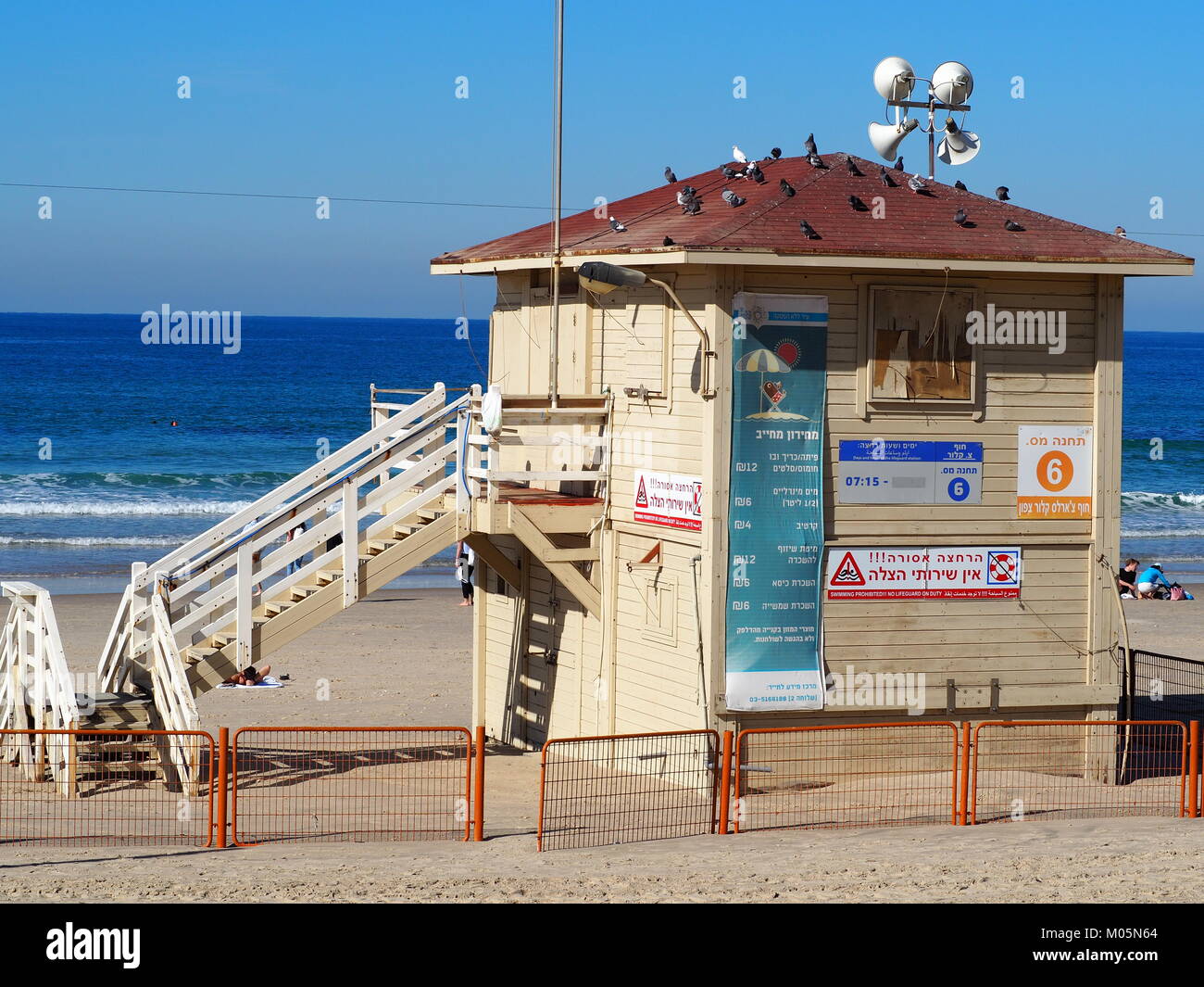 closed lifeguard station with public notice signs that bathing is ...