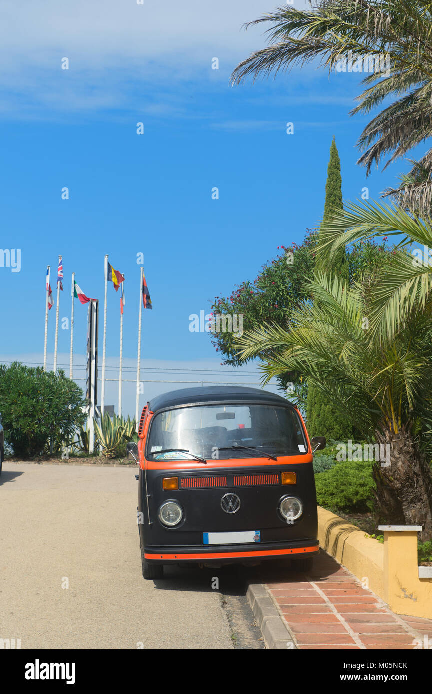 Old black and orange volkswagen bus on the road Stock Photo - Alamy