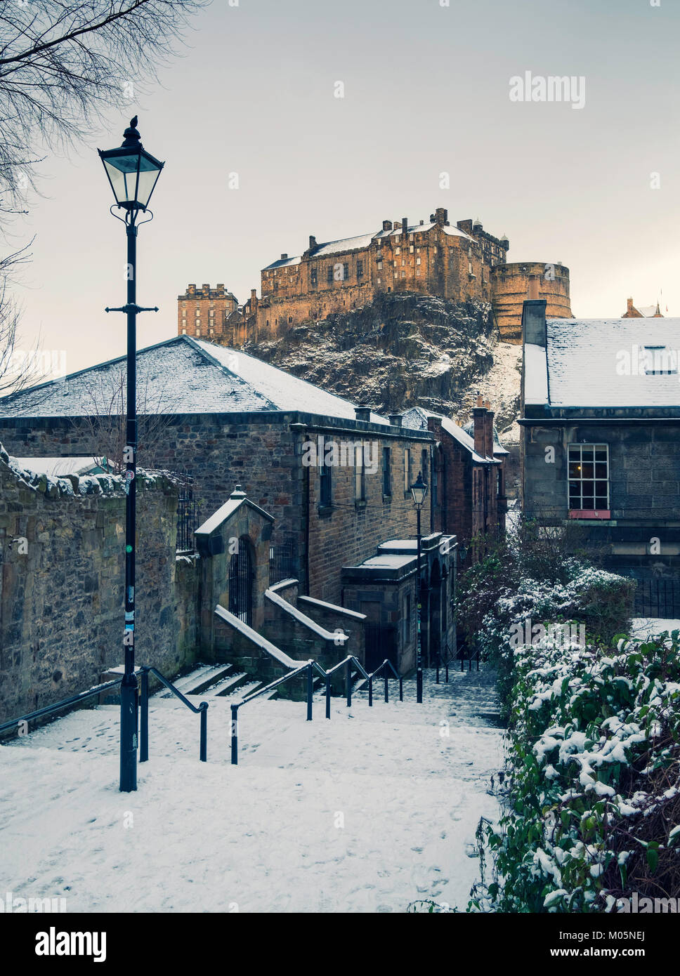 View of Edinburgh Castle after snow from the historic Vennel steps at ...