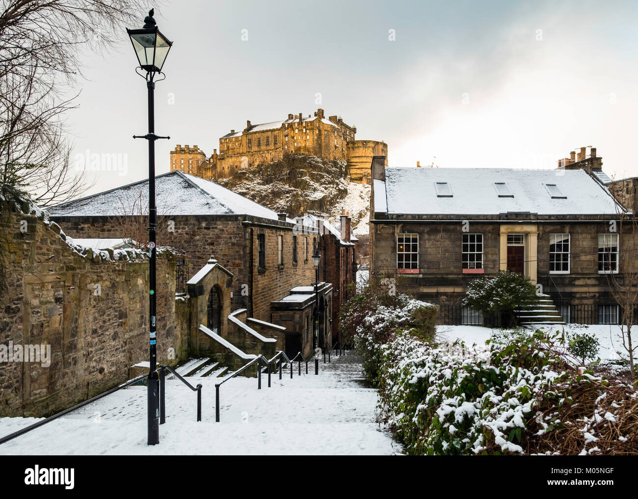 View of Edinburgh Castle after snow from the historic Vennel steps at ...