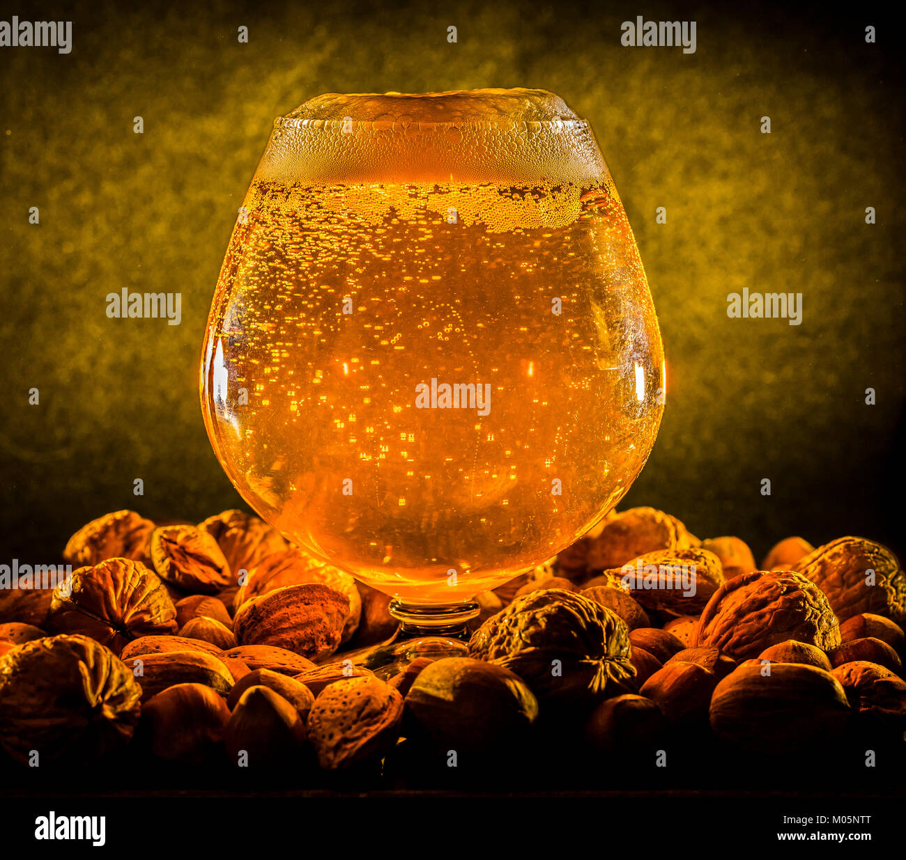 goblet of draft draught beer surrounded by nuts Stock Photo - Alamy