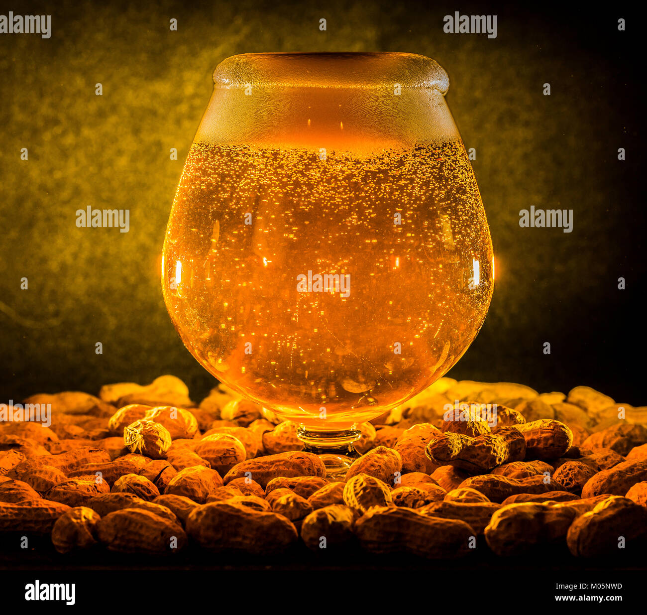 goblet of draft draught beer surrounded by nuts Stock Photo - Alamy