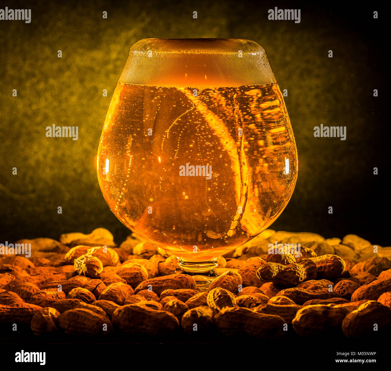 goblet of draft draught beer surrounded by nuts Stock Photo - Alamy