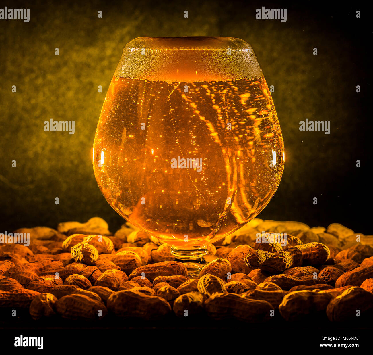 goblet of draft draught beer surrounded by nuts Stock Photo - Alamy