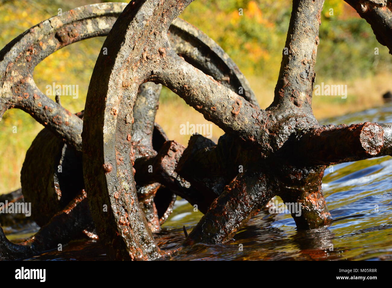 Rusty metal Wheels in a lake Stock Photo - Alamy