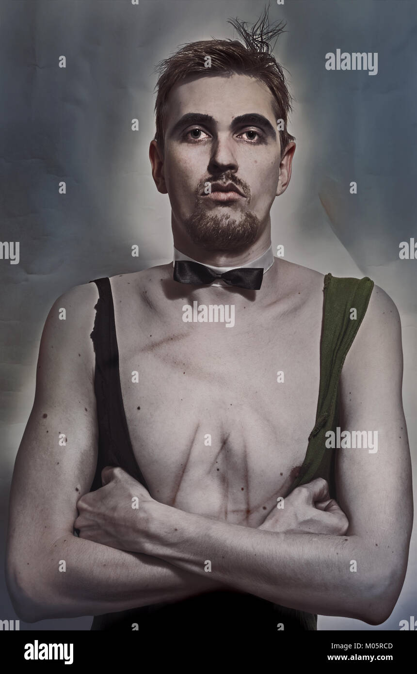 Portrait of a young man with stern look closeup Stock Photo - Alamy