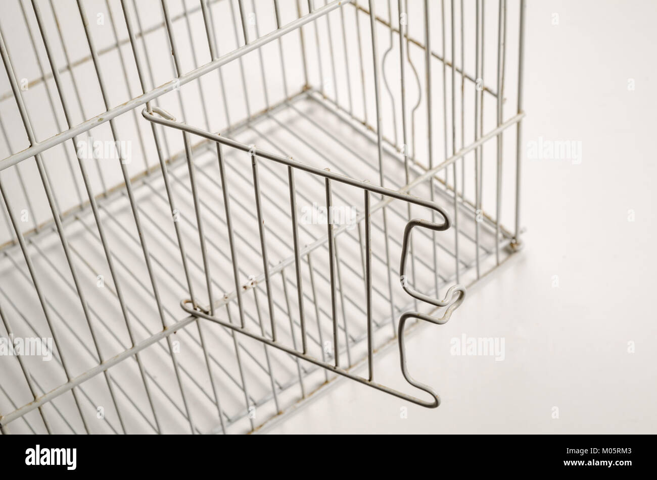 Cage with an open door, a conceptual shot on freedom Stock Photo - Alamy