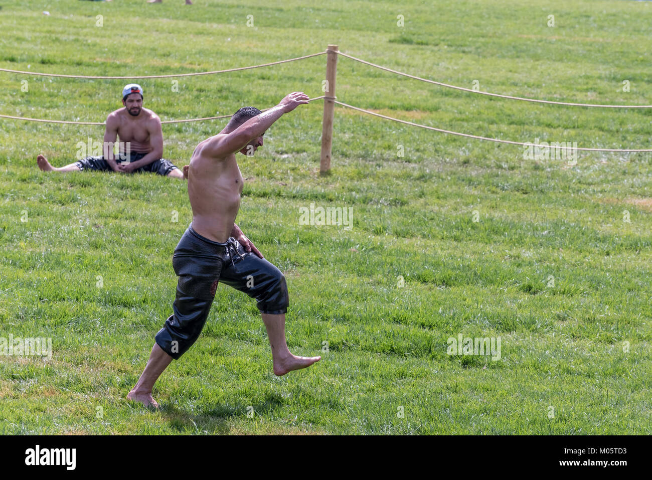 Unidentified Turkish people perform oil wrestling.Oil wrestling or ...