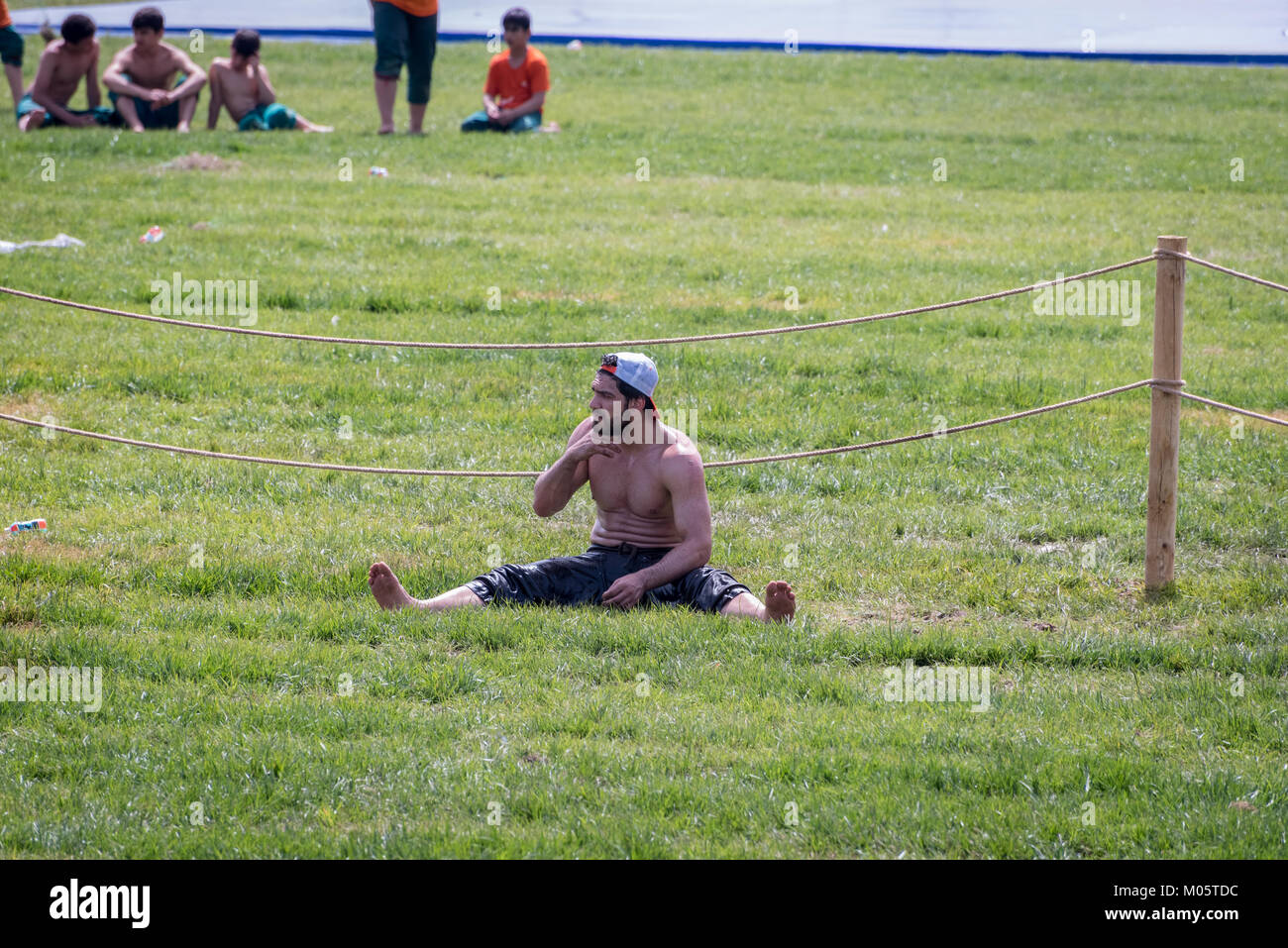 Unidentified Turkish people perform oil wrestling.Oil wrestling or ...