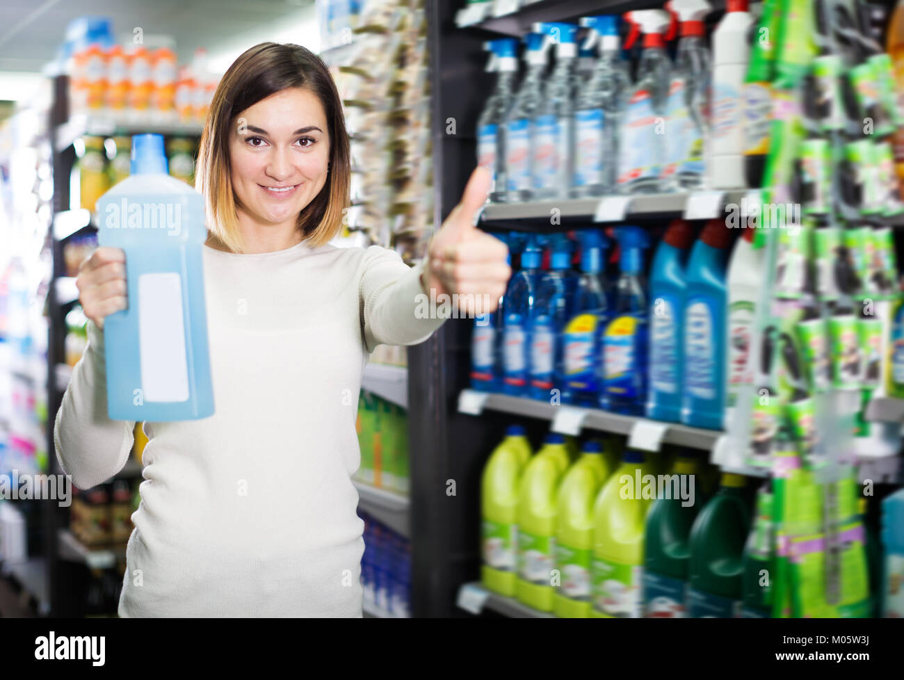 Female shopper searching for cleaners in supermarket Stock Photo - Alamy