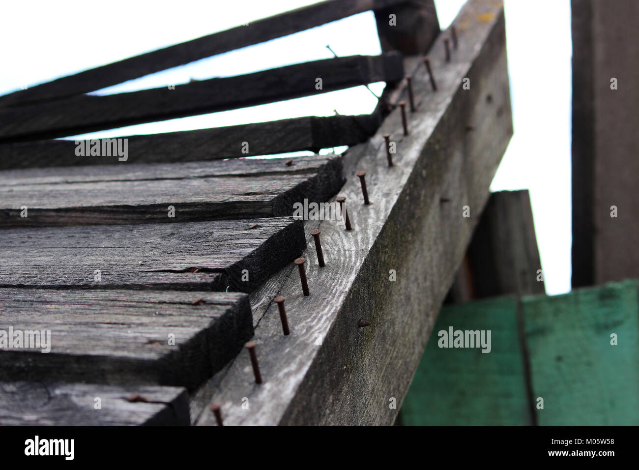 The old wooden canopy protecting people passing by building from ...