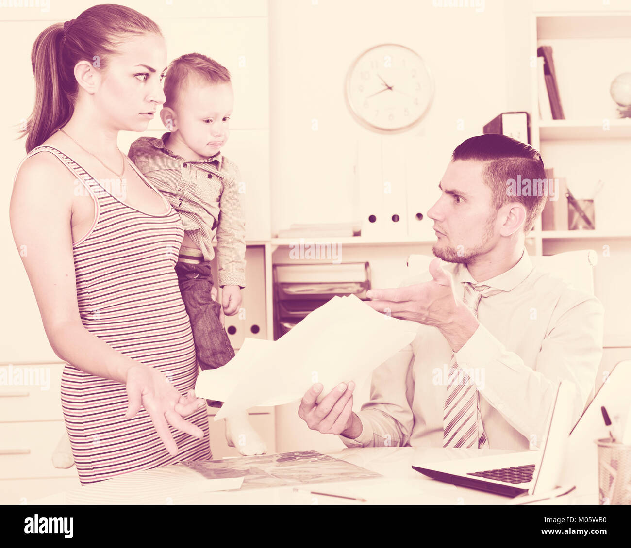 Portrait of frowning manager of insurance company with angry female ...