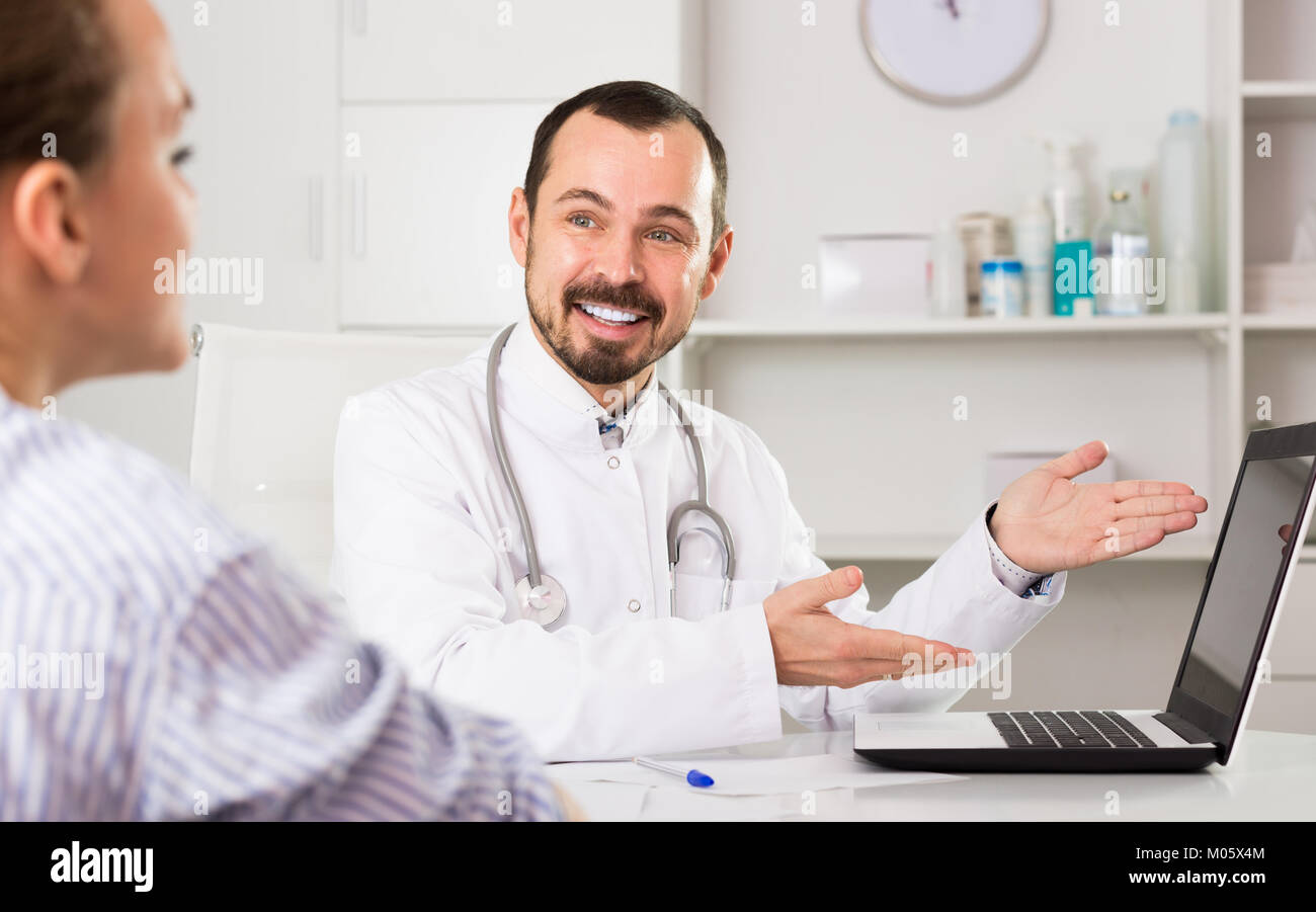 Client visiting consultation with man positive doctor in hospital Stock ...