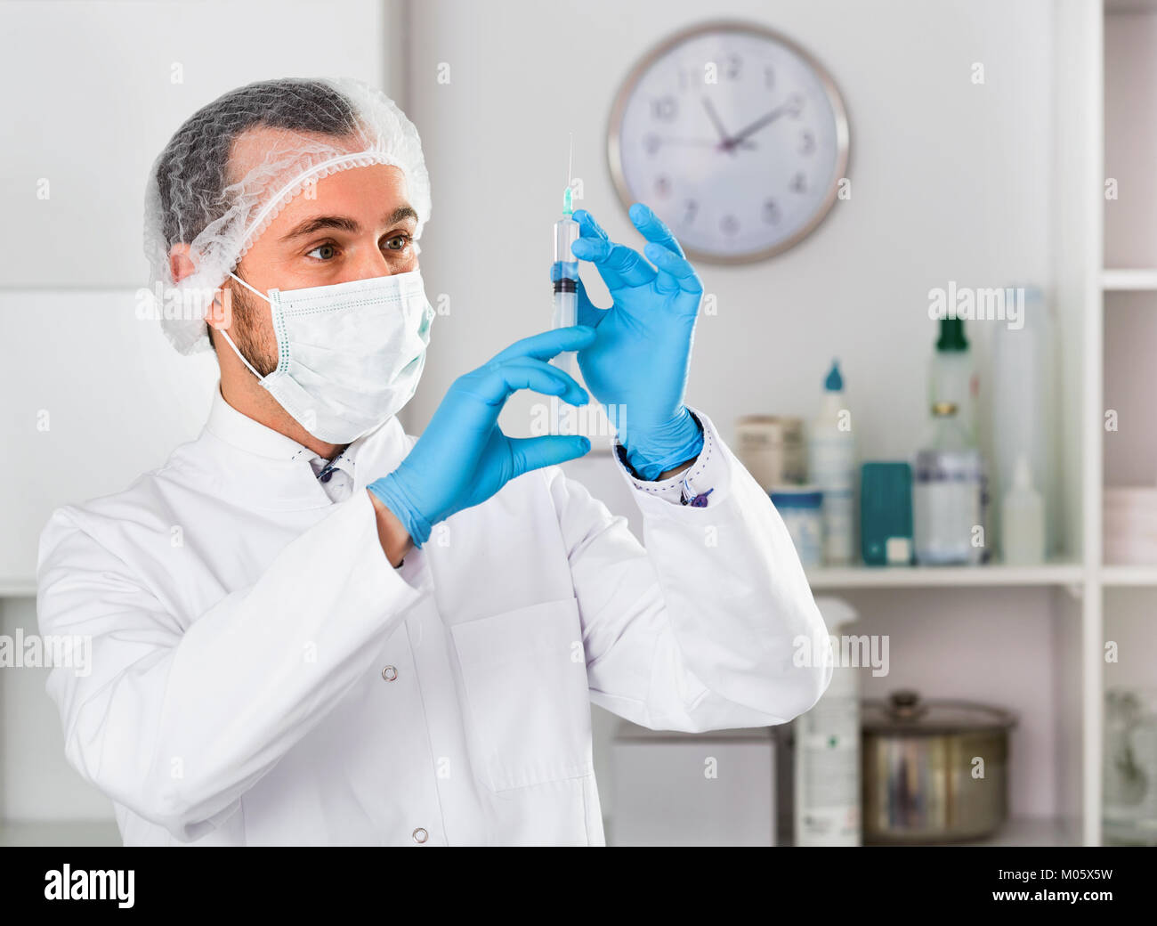 Male nurse preparing injection with syringe in hospital Stock Photo - Alamy