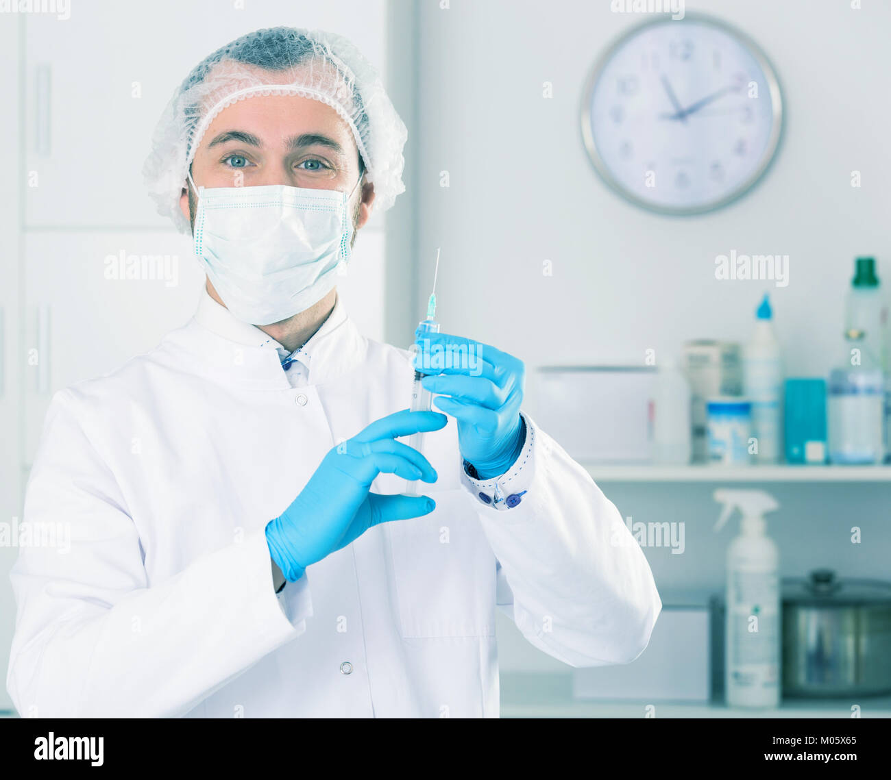 Male nurse preparing injection with syringe in hospital Stock Photo - Alamy