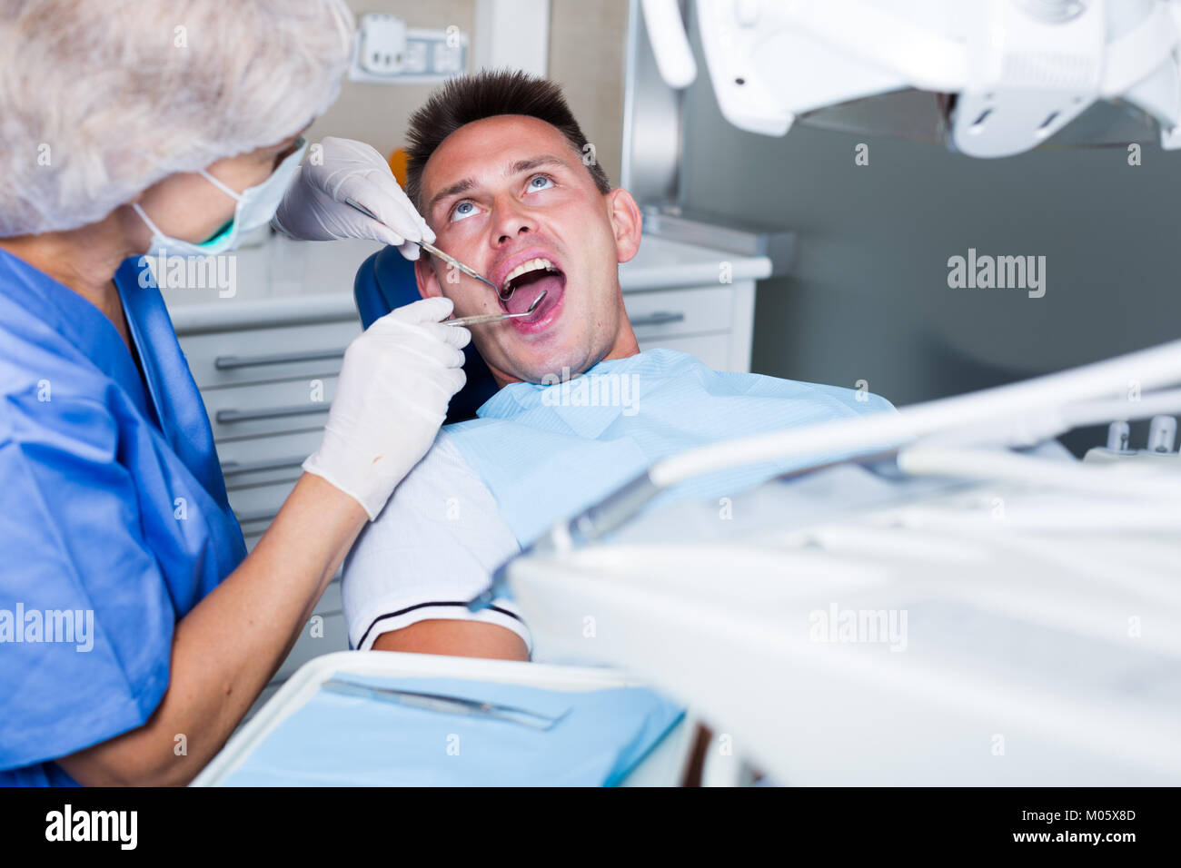 Young man visiting dentist, taking care of his health and dental ...