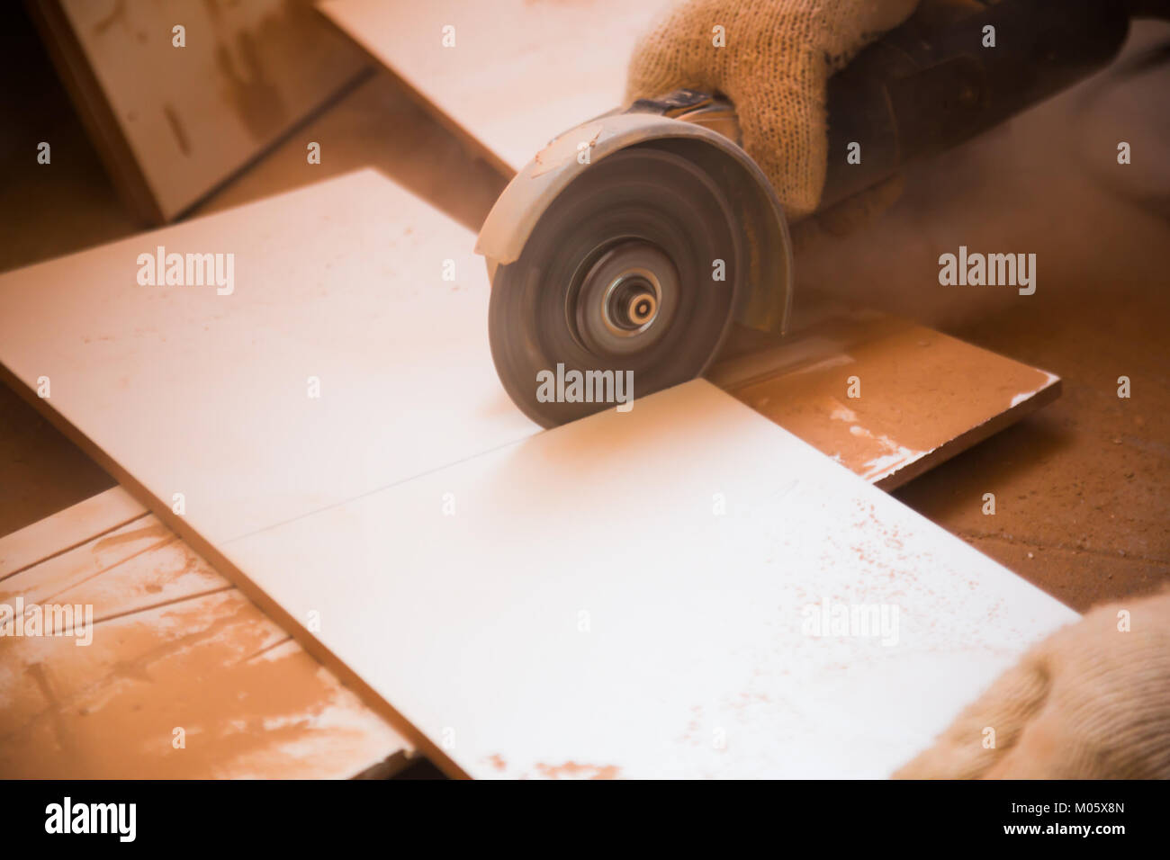 side grinder working on paving tile on building site Stock Photo - Alamy