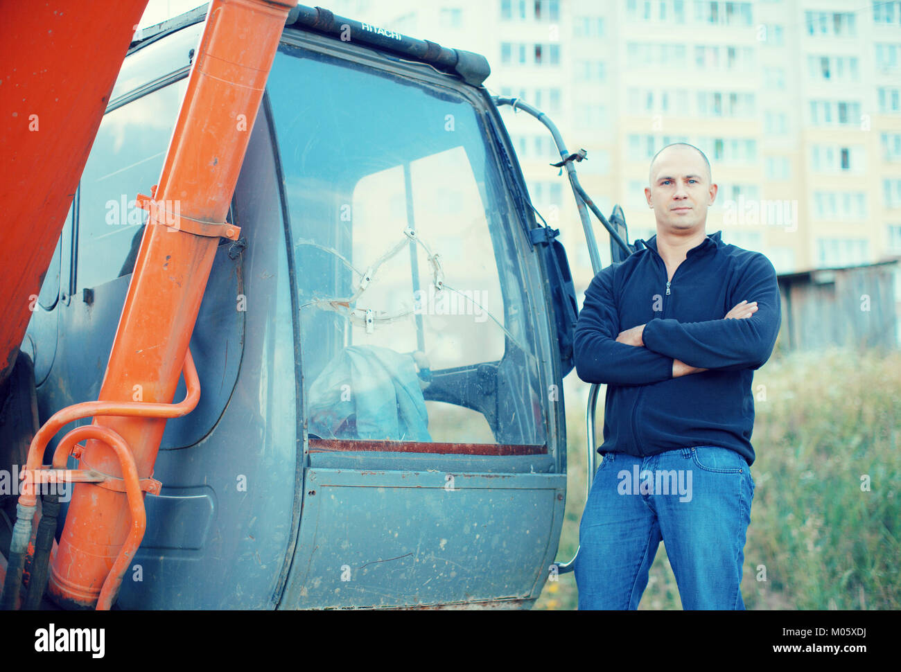 Portrait of tractor operator at construction site Stock Photo - Alamy