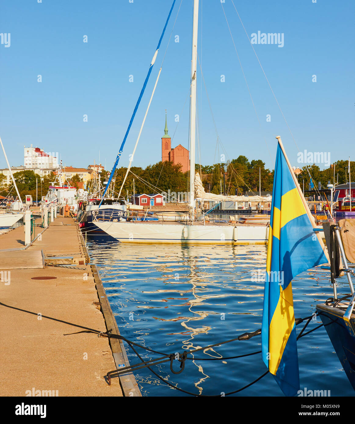 Nynashamn harbour with Nynashamn Church on a cliff in the background ...