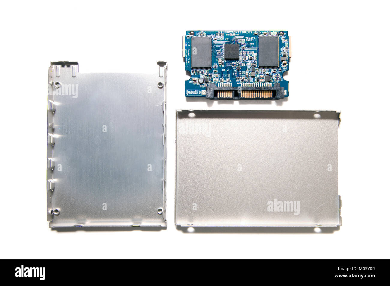 Disassembled solid state drive parts isolated on a white background ...