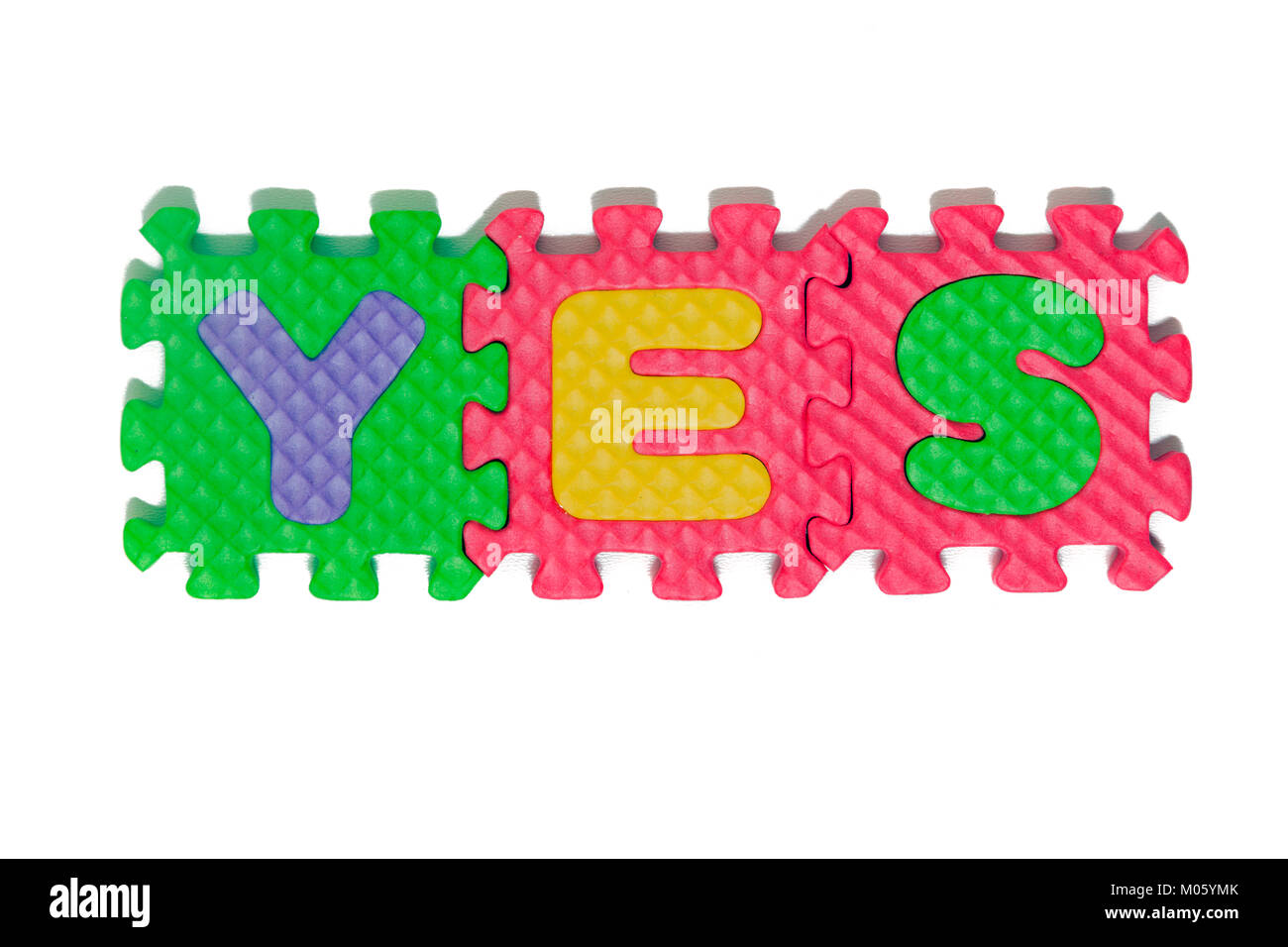 Foam puzzle letter uppercase with word Yes isolated on a white ...