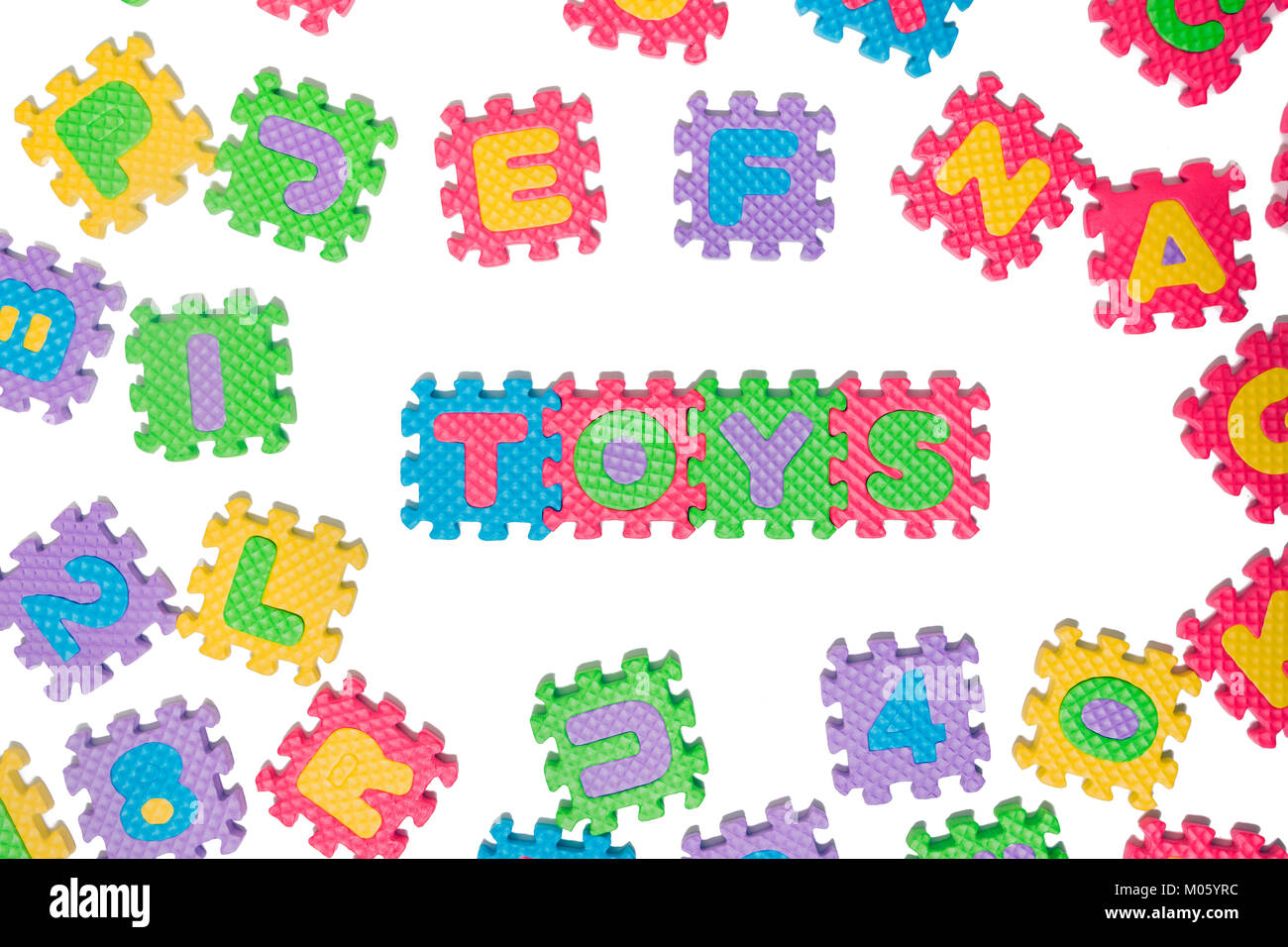 Foam puzzle letter uppercase with word Toys isolated on a white ...