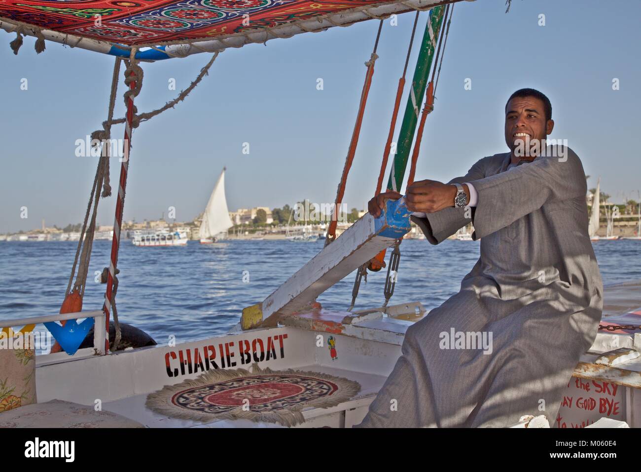 Felucca boat on the Nile by Luxor with Egyptian sailor Stock Photo - Alamy