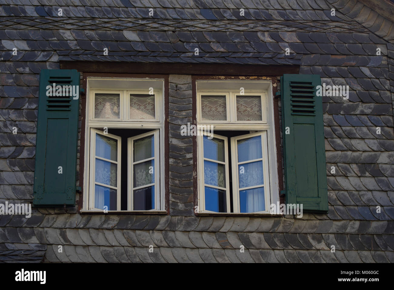 Slate-clad wall with two windows in the Hunsrueck mountains. Herrstein ...