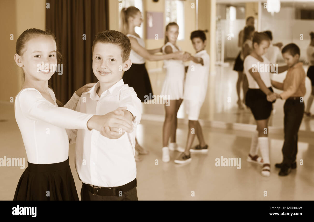 Portrait of smiling children enjoying of partner dance in class Stock ...