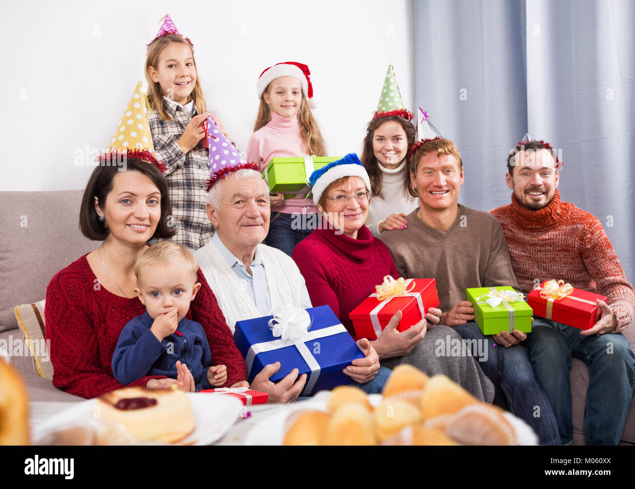 Family members making a family photo during reunion party on sofa Stock ...
