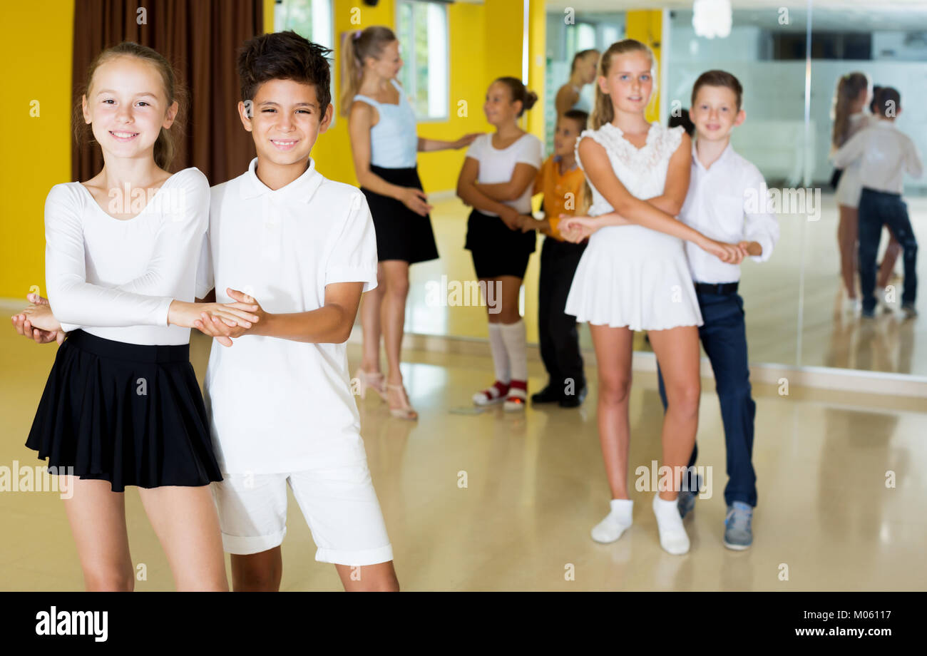 Positive children studying of partner dance at dance studio Stock Photo ...