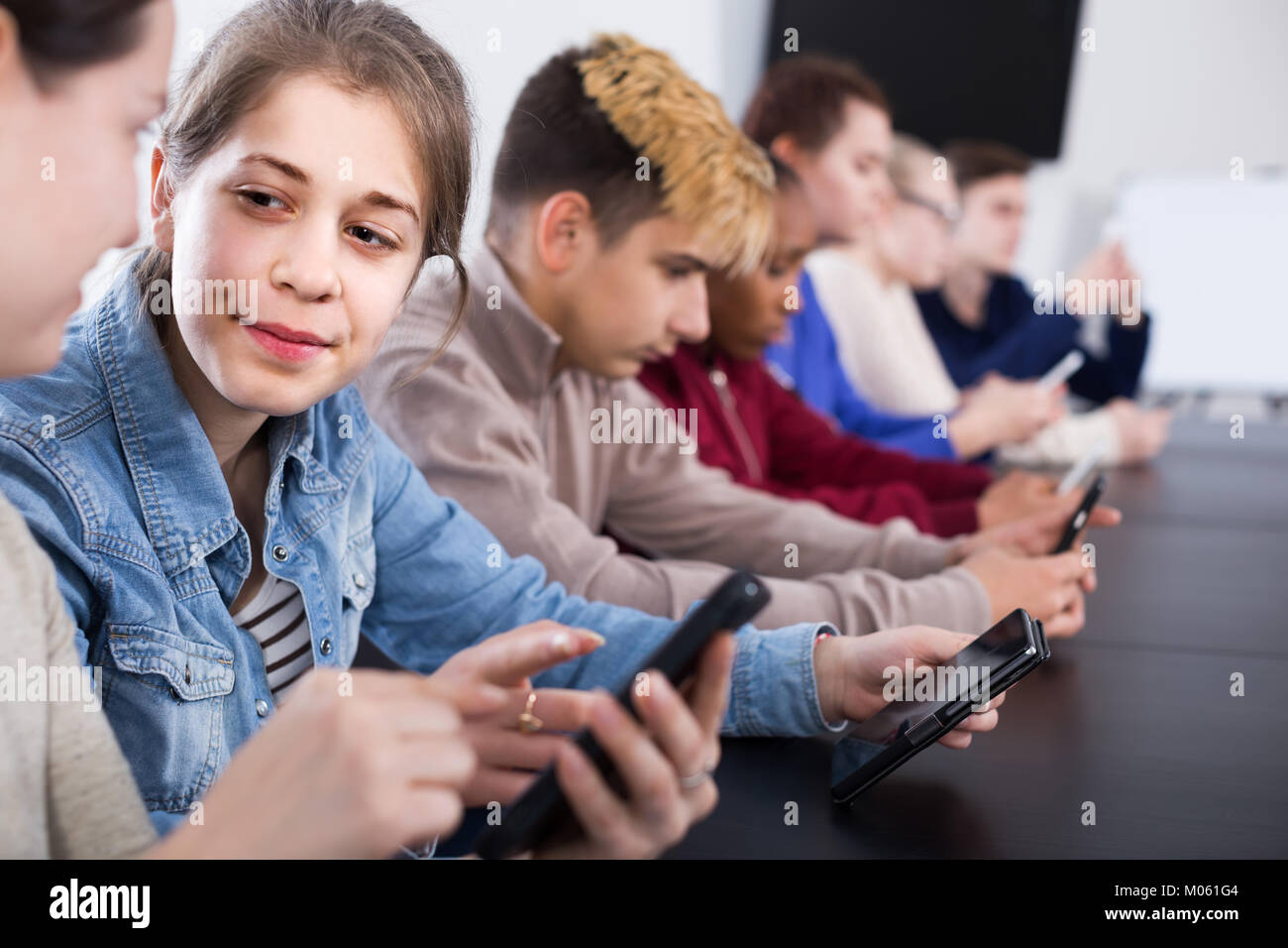 Happy multi ethnic college friends using hi-res stock photography and ...