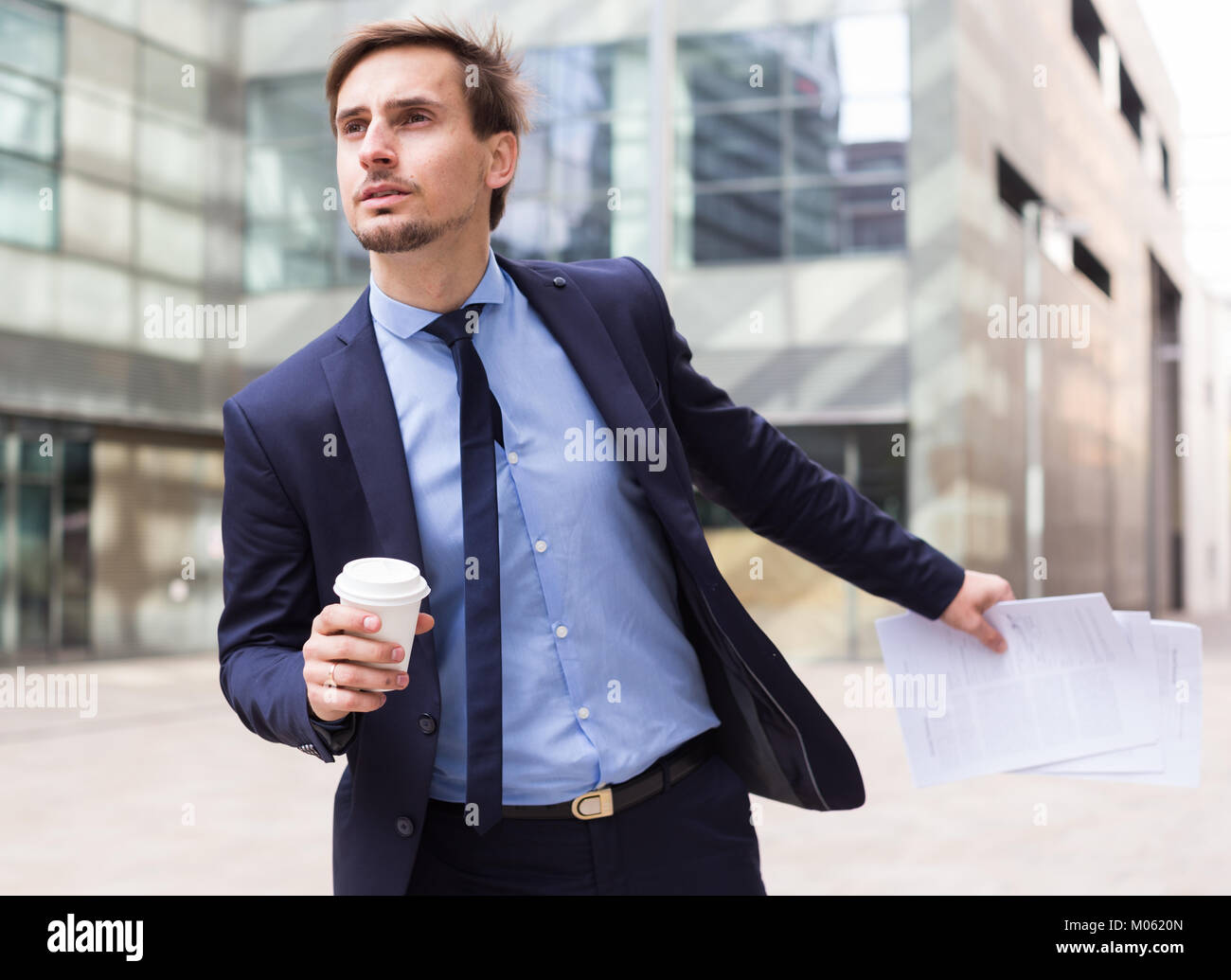 Portrait of busy man in suit rushing to important meeting Stock Photo ...