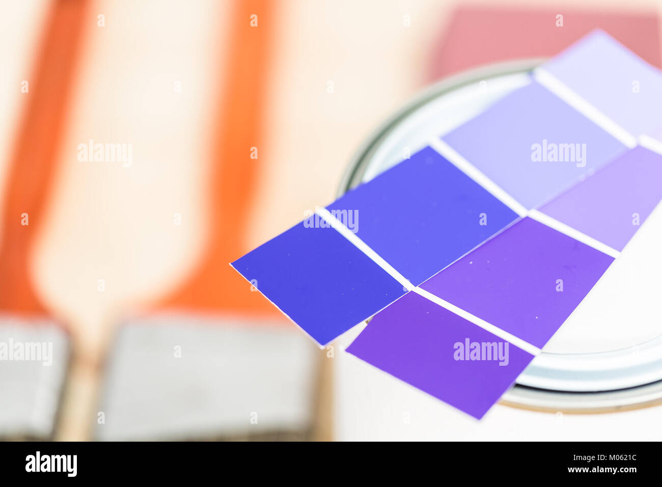 Paint swatches with purple paint sample and metal can with paint Stock ...
