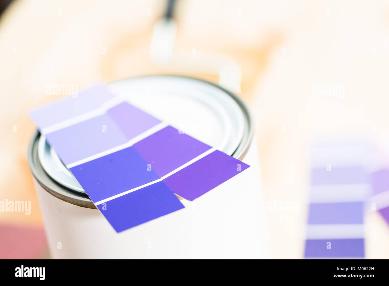 Paint swatches with purple paint sample and metal can with paint Stock ...