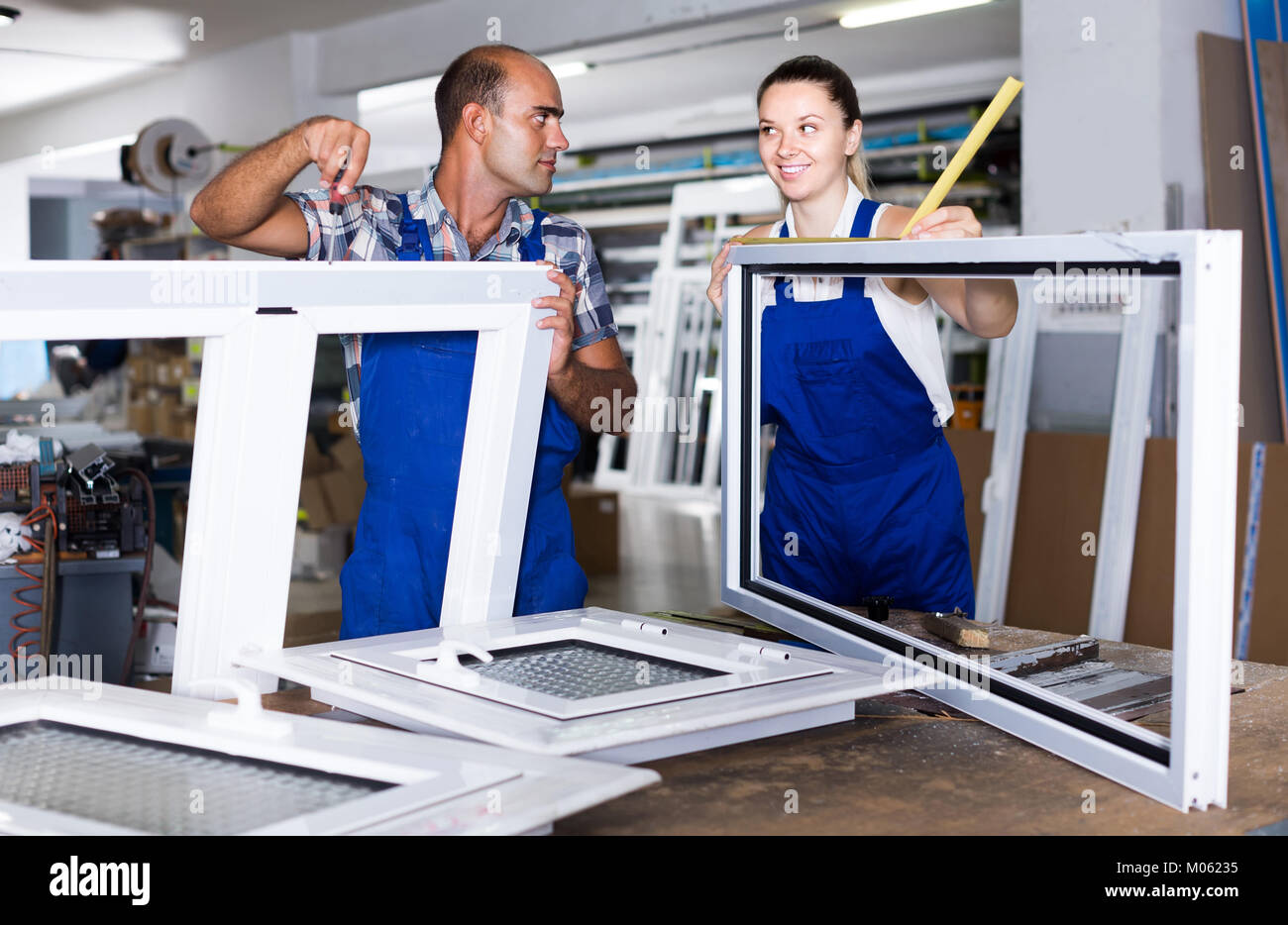 smiling irish foreman explaining plastic windows assembly process to ...