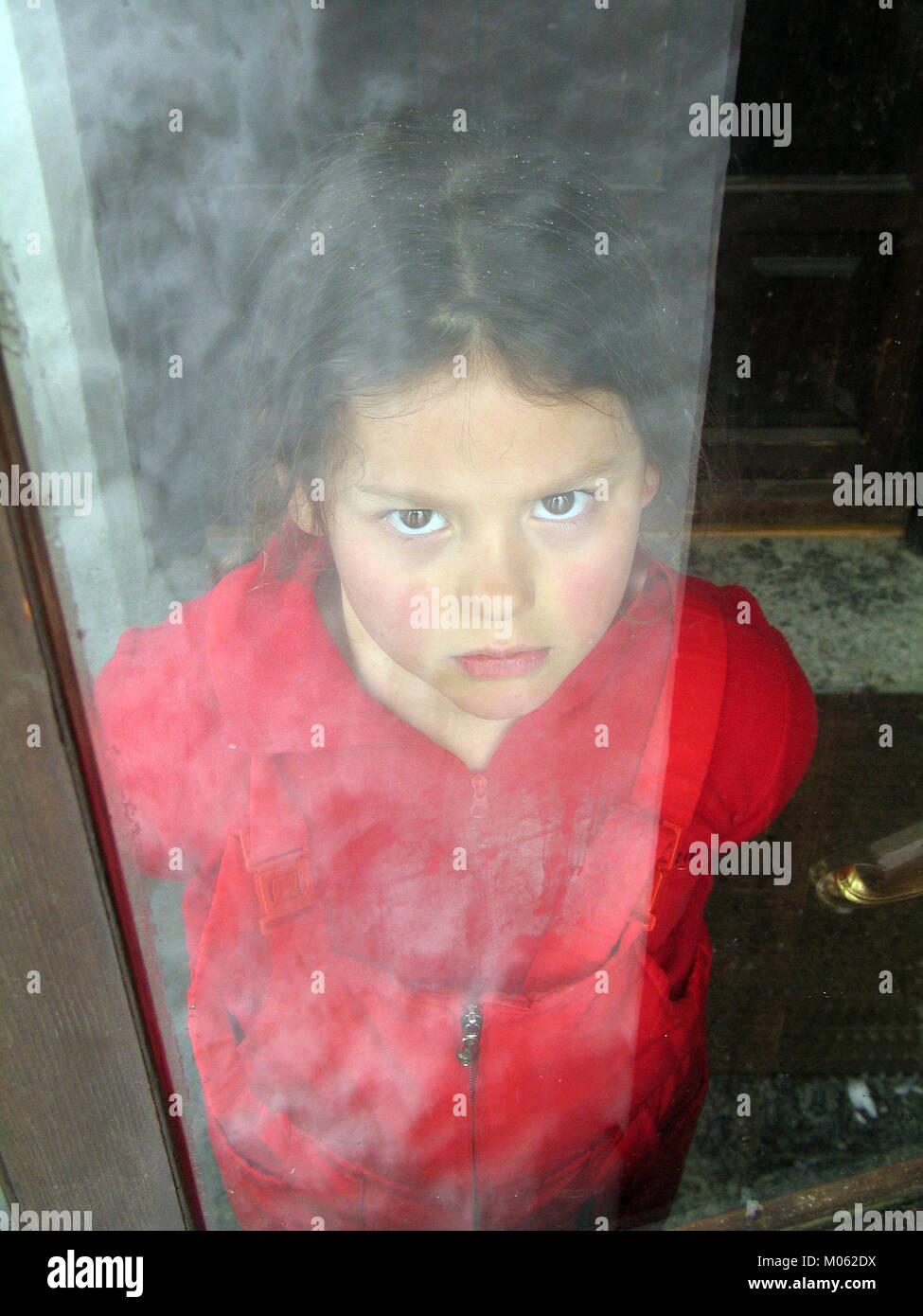 little girl in a corner Stock Photo - Alamy