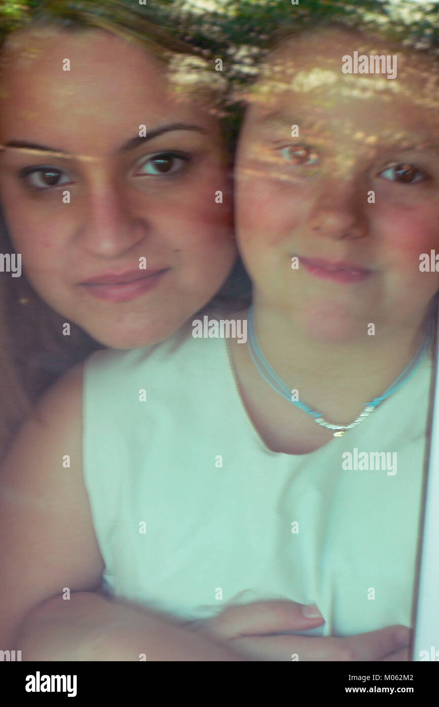 sisters at the window Stock Photo - Alamy