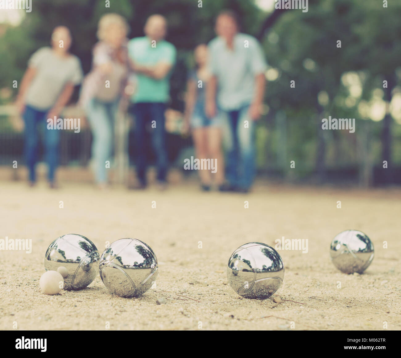 Portrait of friendly people playing petanque at leisure Stock Photo - Alamy