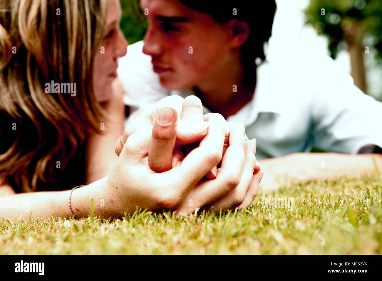 couple touching hands Stock Photo - Alamy